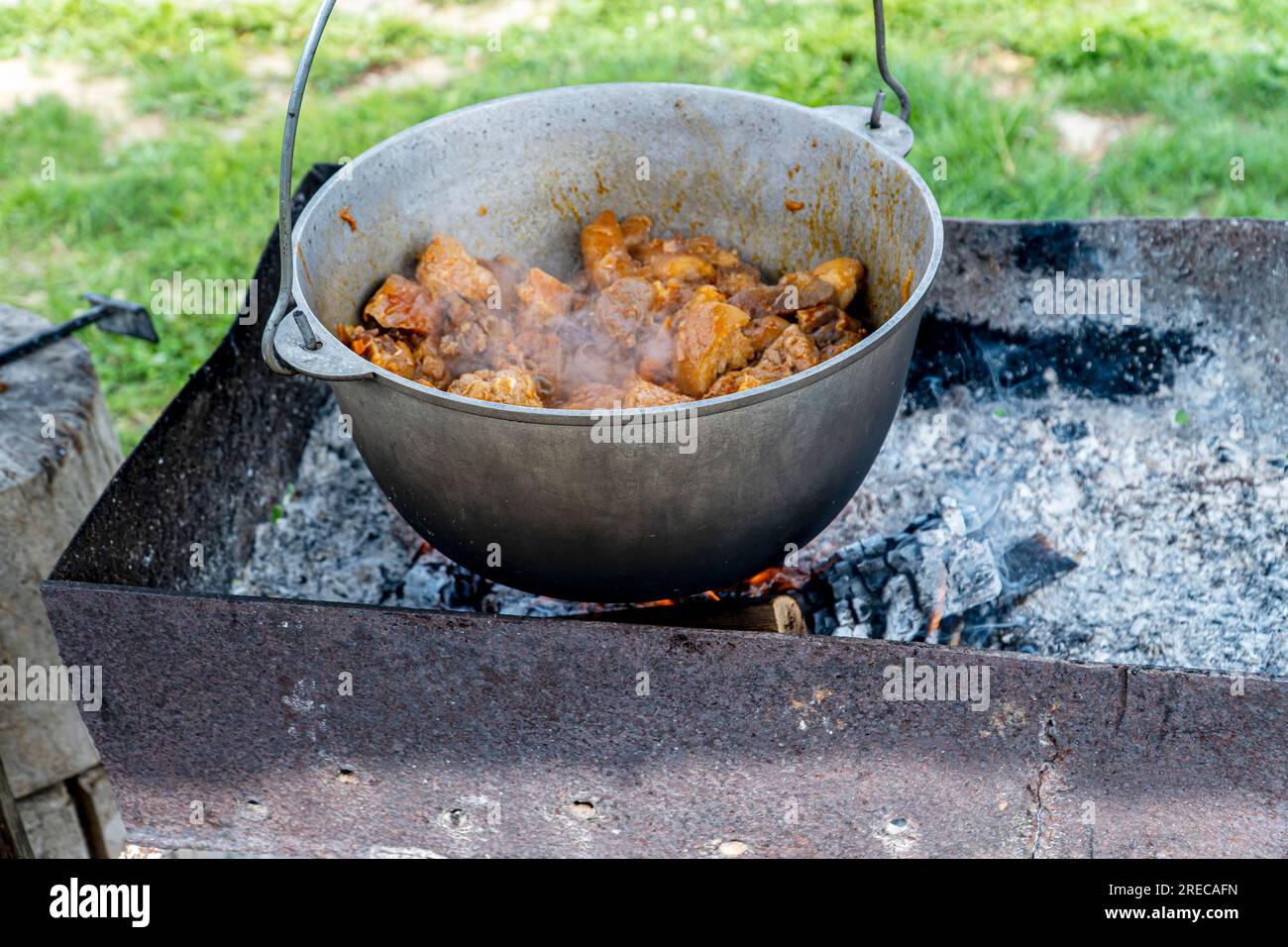 Cooking in nature. Kettle on fire Stock Photo - Alamy