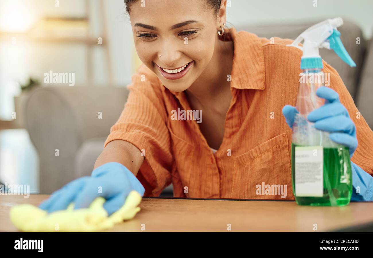 Spray, woman and smile for cleaning table, furniture and housekeeping ...