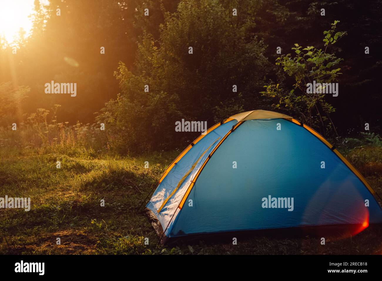 Inspiration camping place with blue tent during sunrise. Beautiful ...