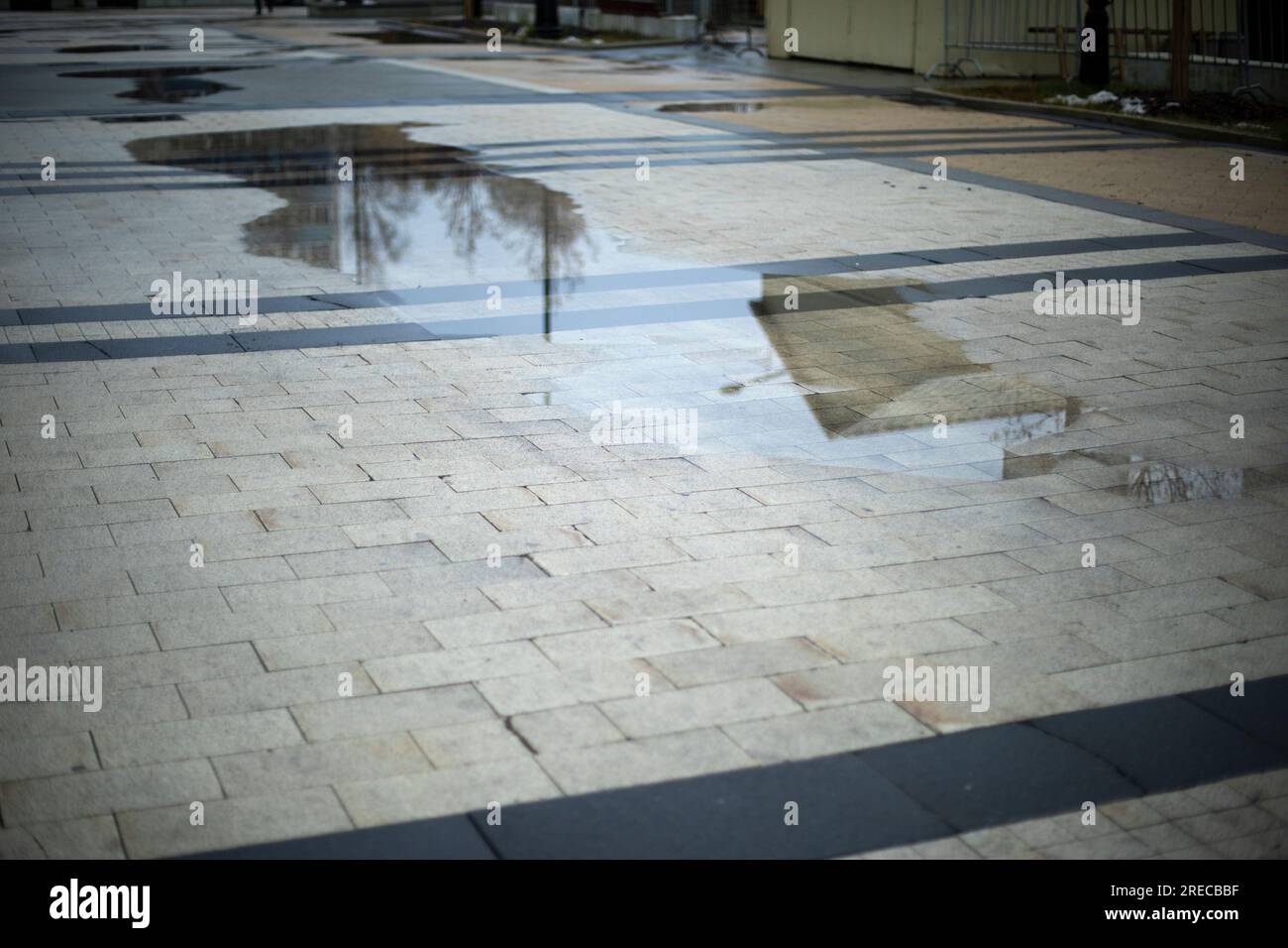 Rain outside. Puddle in square. City in rain. Details of square Stock ...