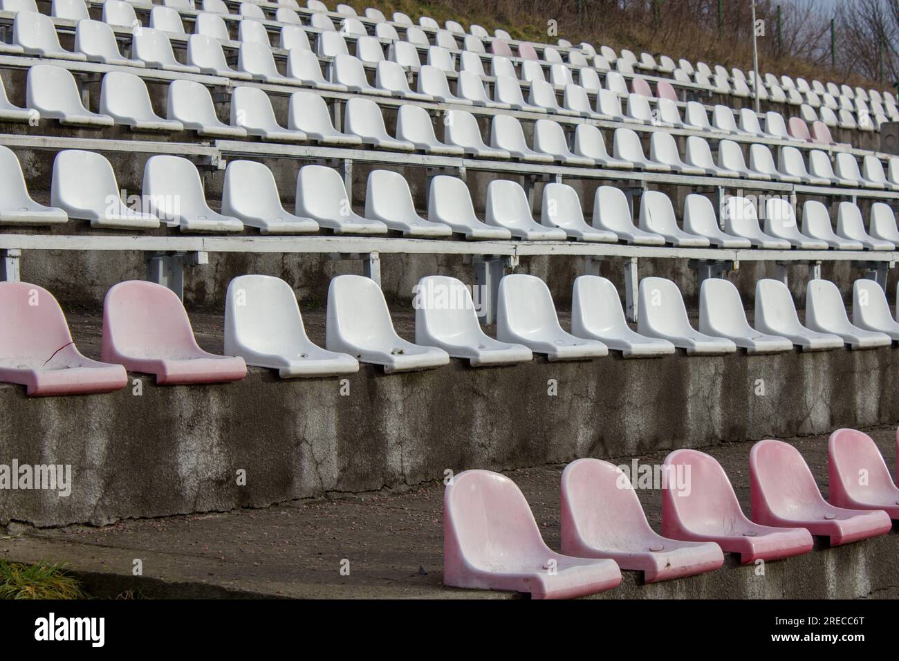 the old football stadium abandoned, the chairs of an empty football ...
