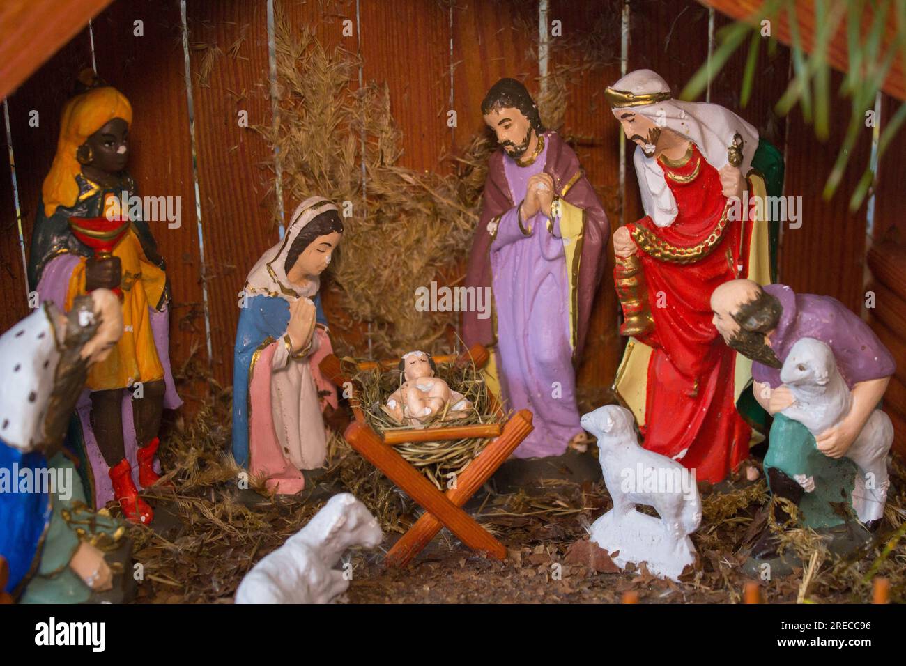 wooden nativity scene with religious statuettes Stock Photo - Alamy