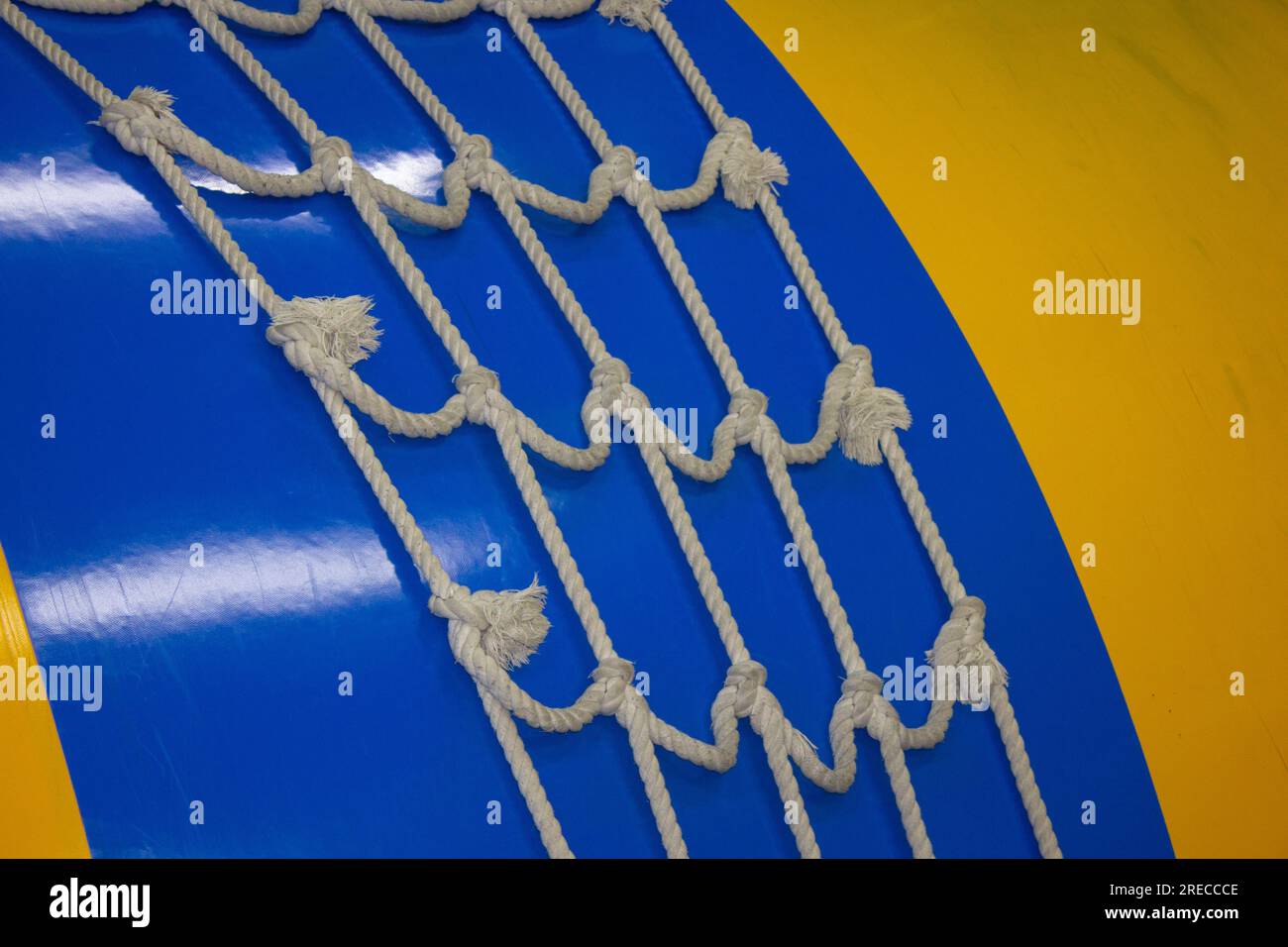 ladder rope in the amusement park that rises above the pool Stock Photo ...