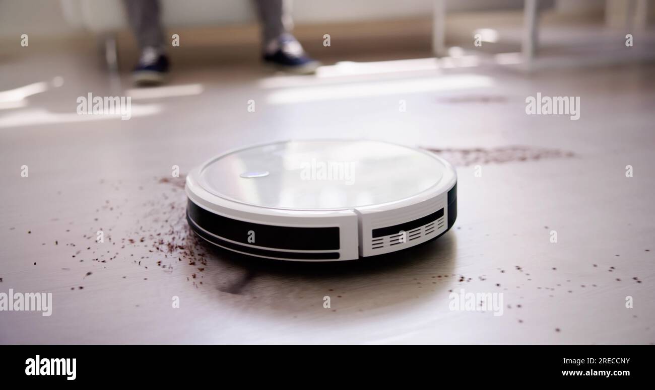 Electric Vacuum Cleaning Robot Technology At Modern Home Stock Photo ...
