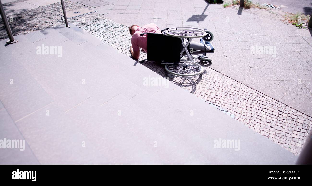 Wheelchair Fall Accident. Sad Man In Pain Stock Photo - Alamy