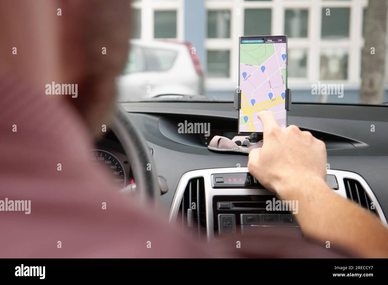 Car With GPS Navigation Maps On Mobile Phone Touchscreen Stock Photo ...