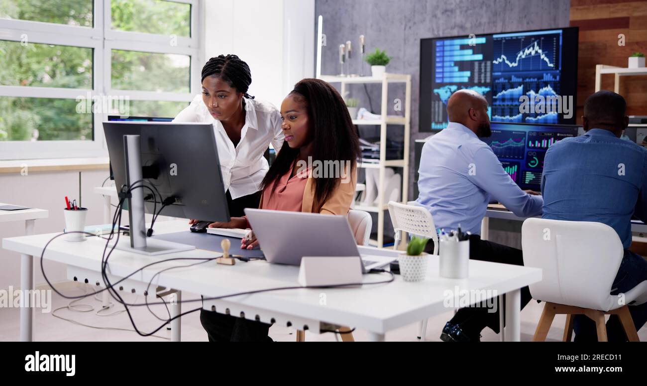 African Financial Data Analysts Using Performance Dashboard On Screens ...