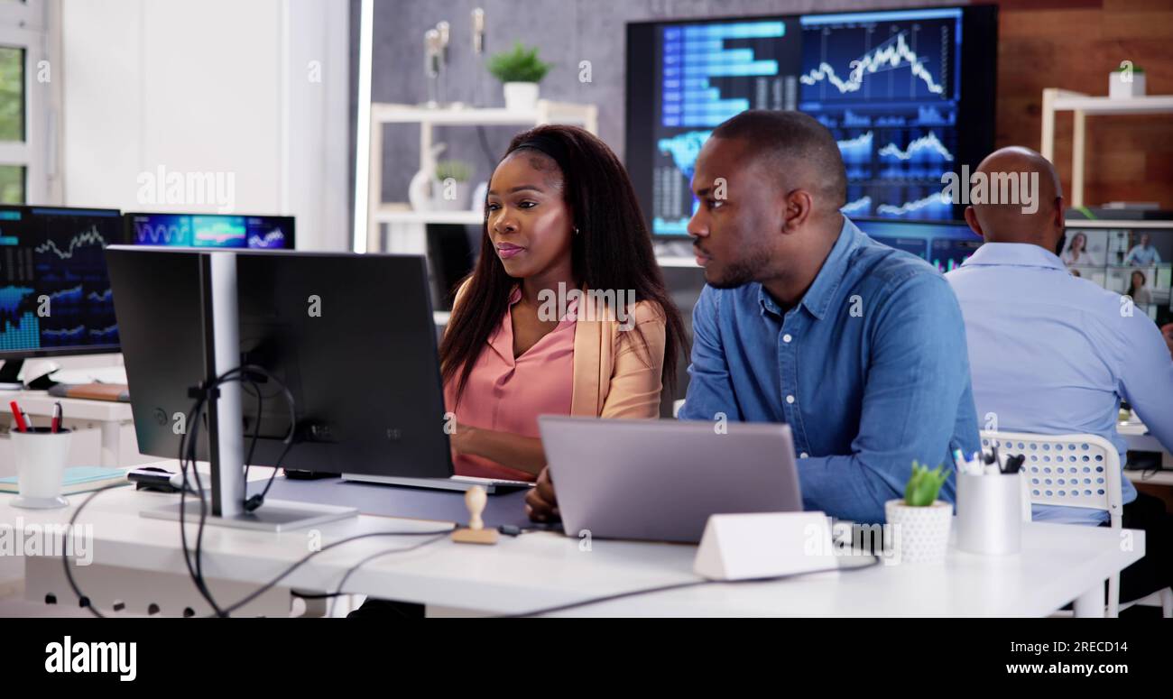 African Financial Data Analysts Using Performance Dashboard On Screens ...