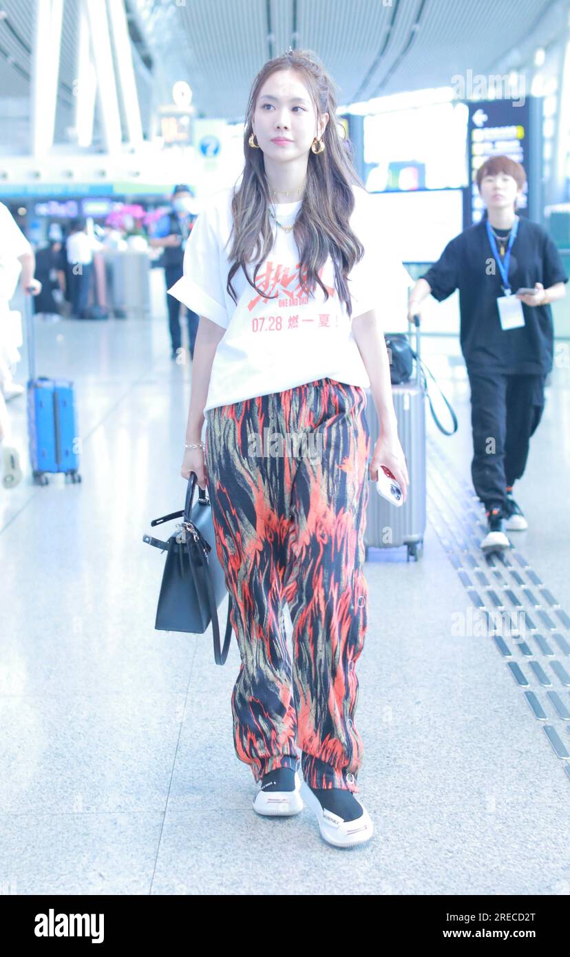 Chinese singer and actress Fei appears at airport in Changsha City ...