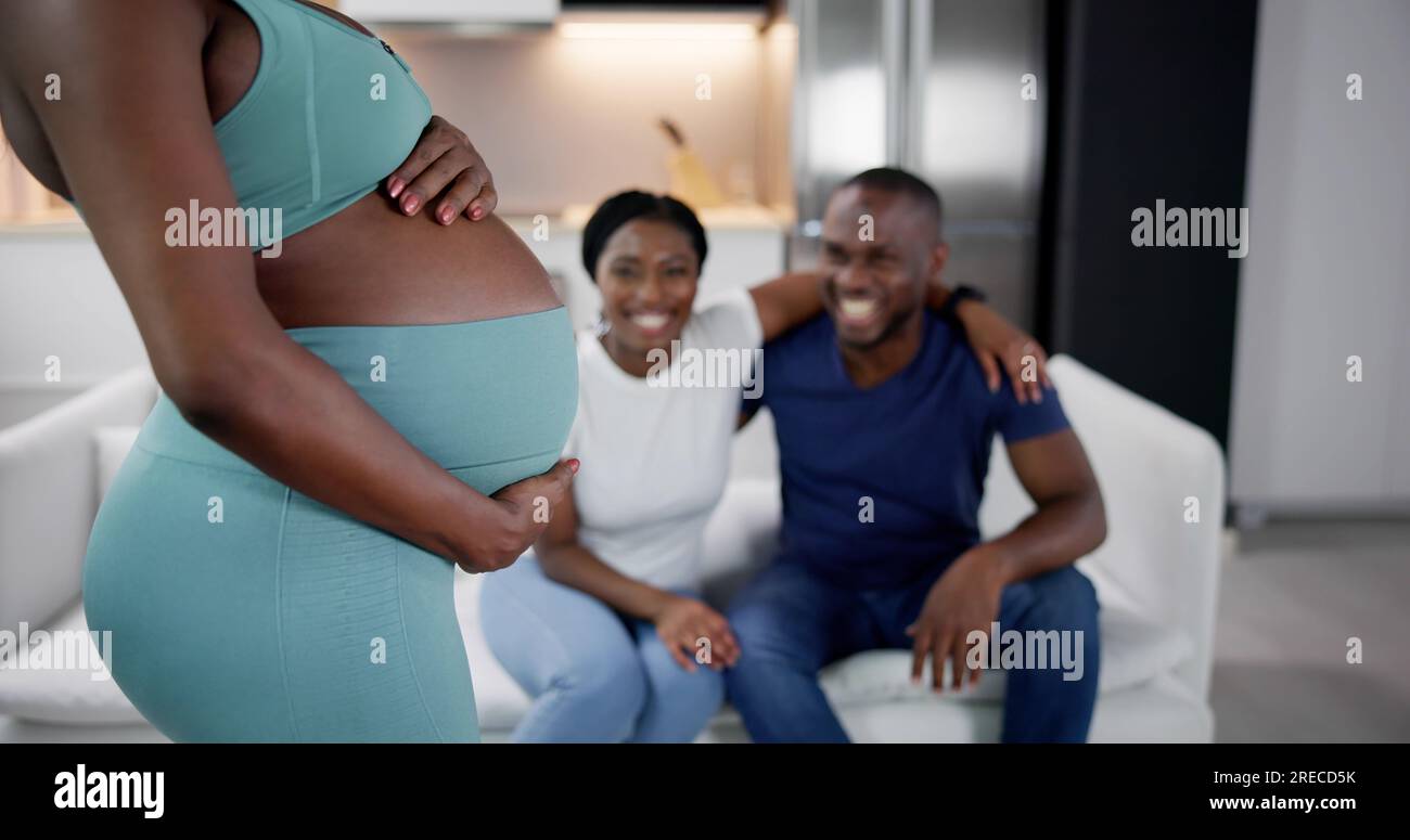 Surrogate Mother In Front Of Happy African Couple Stock Photo - Alamy