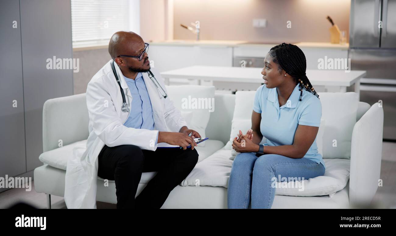 African Medical Doctor Talking To Patient. Health Service Stock Photo ...
