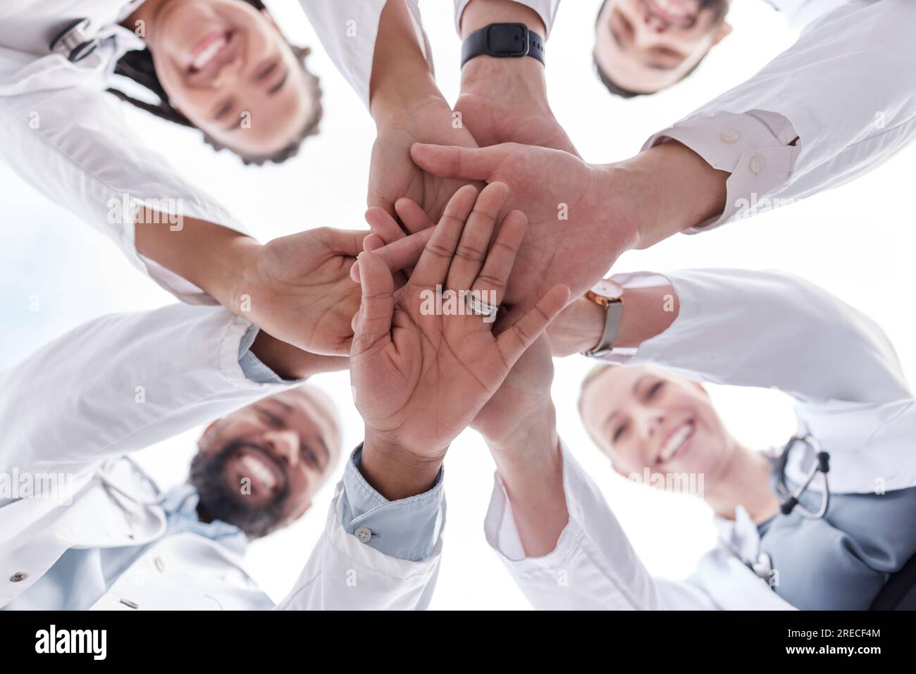 Hospital doctors, happy people and circle hands together for healthcare teamwork, medical team ...