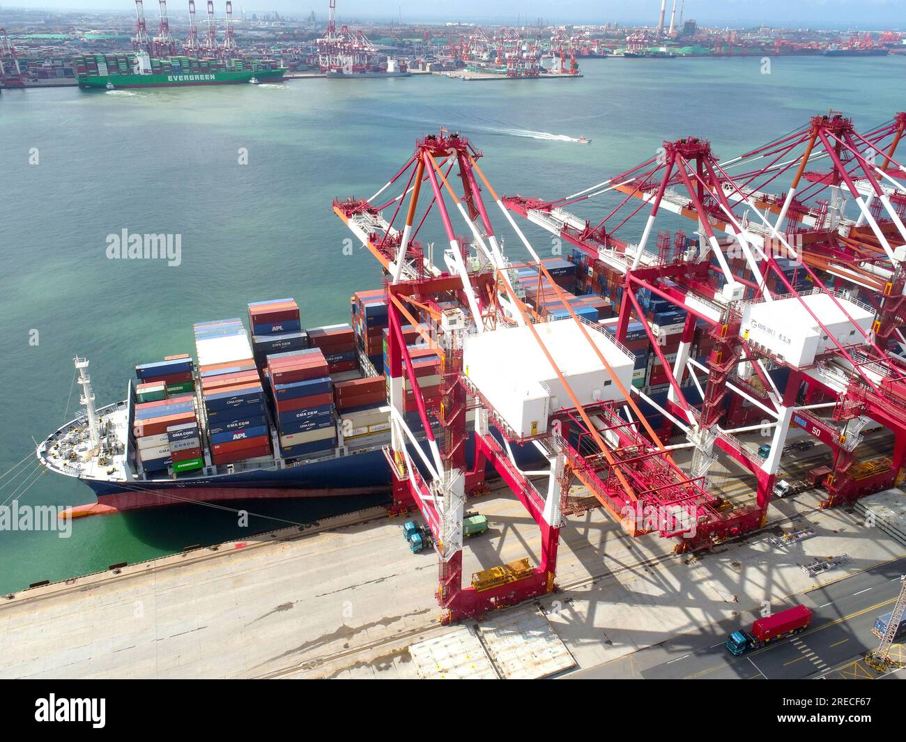 QINGDAO, CHINA - JULY 27, 2023 - Cargo ships load and unload cargo at ...