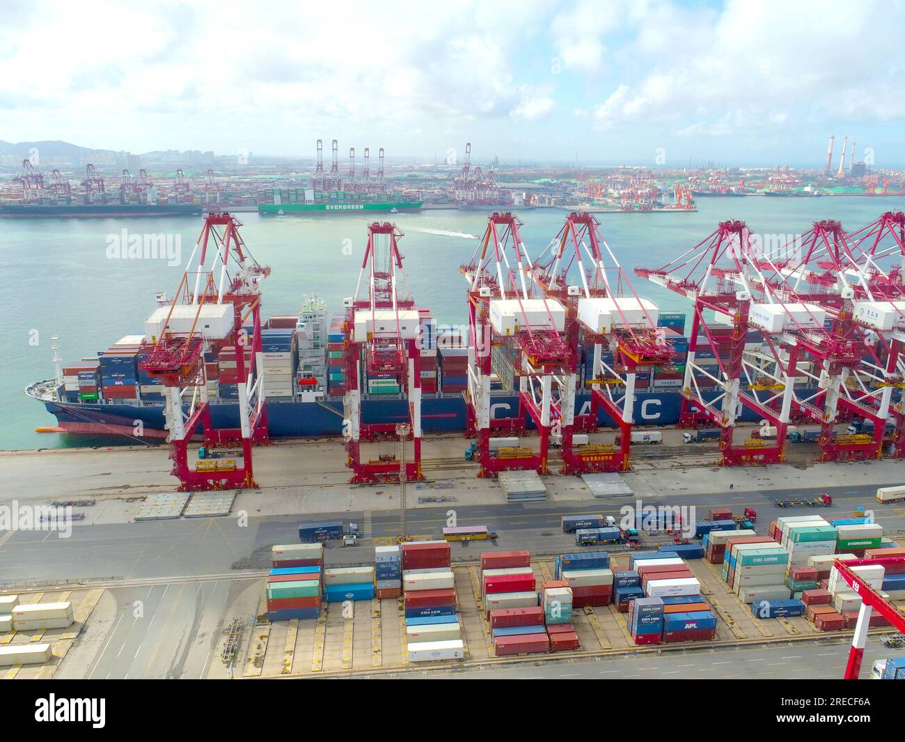 QINGDAO, CHINA - JULY 27, 2023 - Cargo ships load and unload cargo at ...