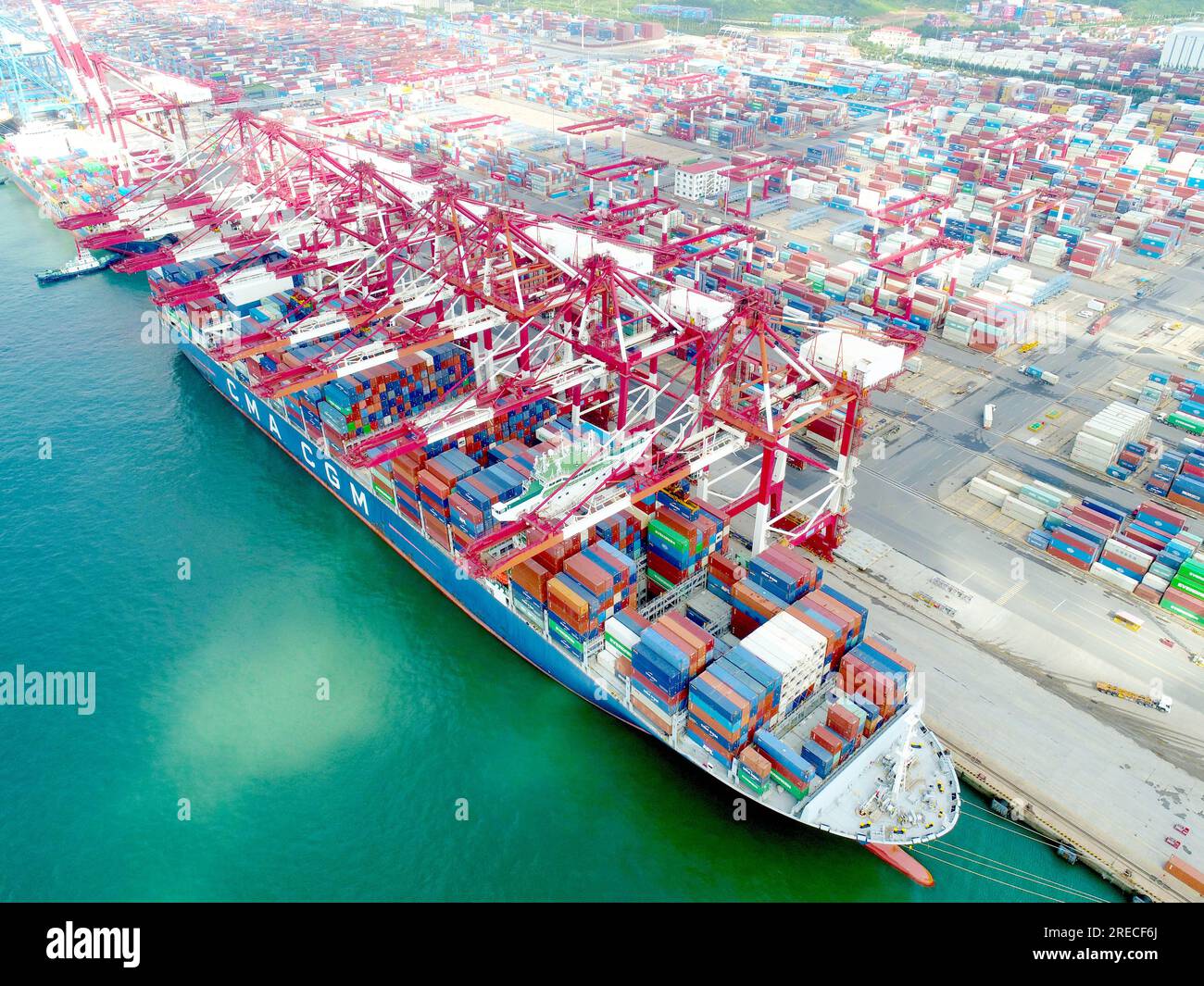 QINGDAO, CHINA - JULY 27, 2023 - Cargo ships load and unload cargo at ...