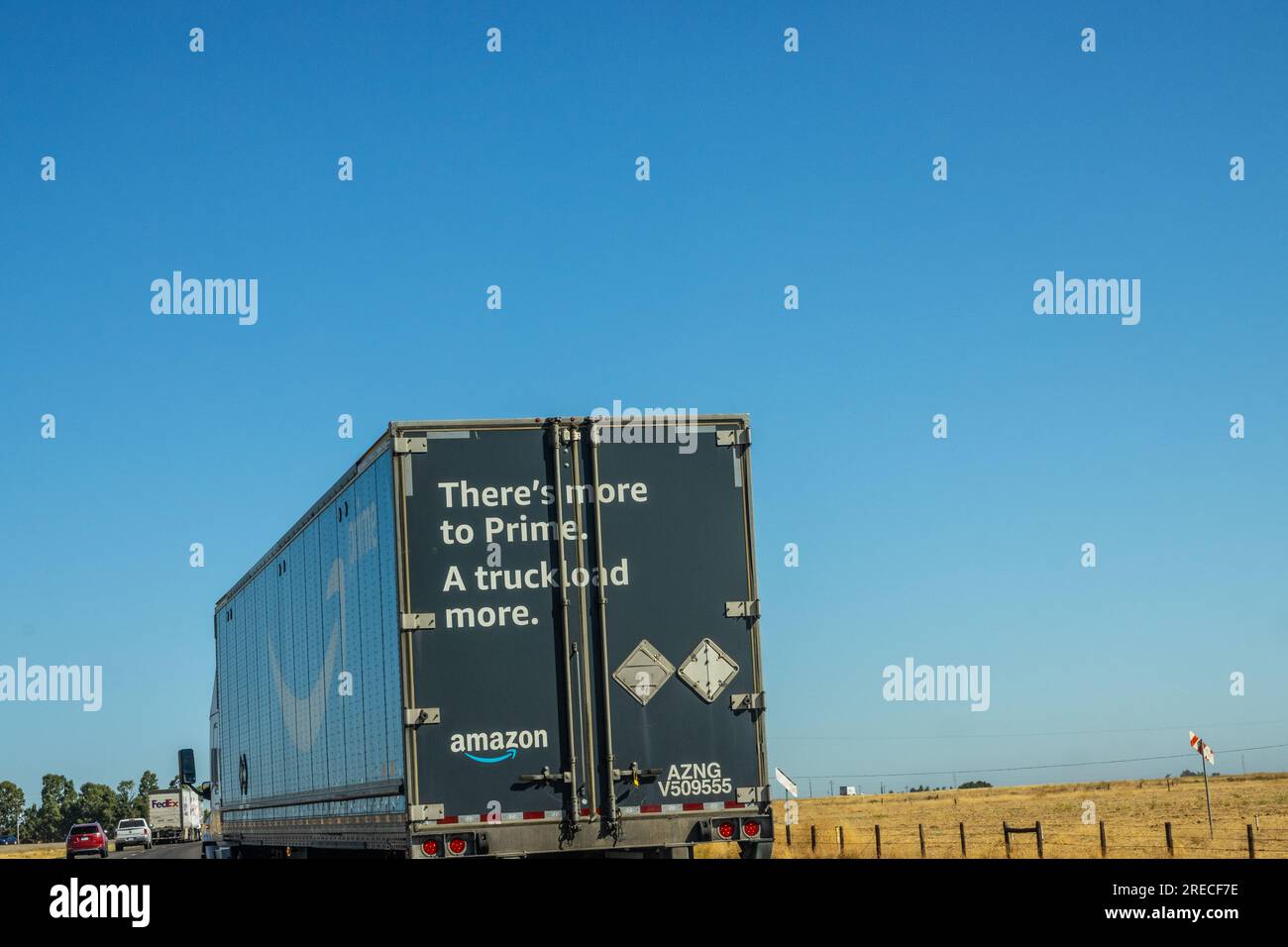 An Amazon truck drives on Interstate 5 in Merced County California USA ...