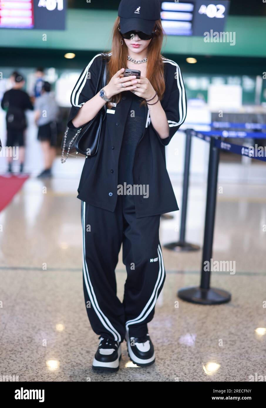 Chinese singer and actress Meng Jia appears at airport in Shanghai ...