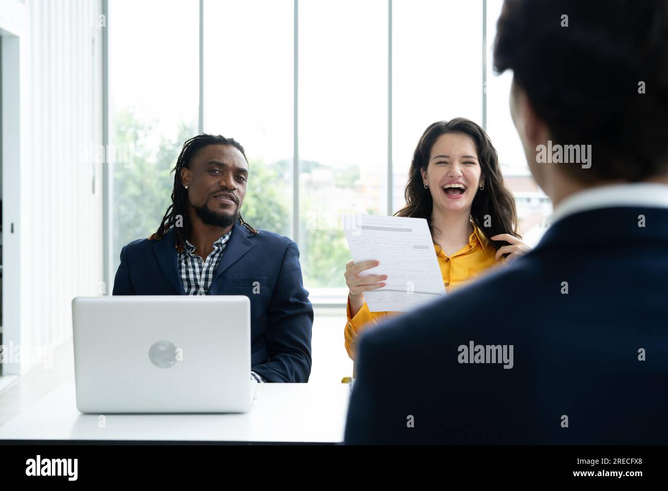 Job interview concept. Diverse hr team doing job interview with a man ...