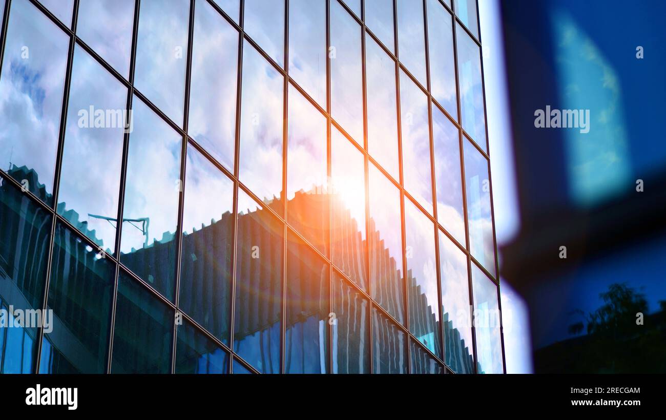 Structural glass wall reflecting blue sky. Abstract modern architecture ...