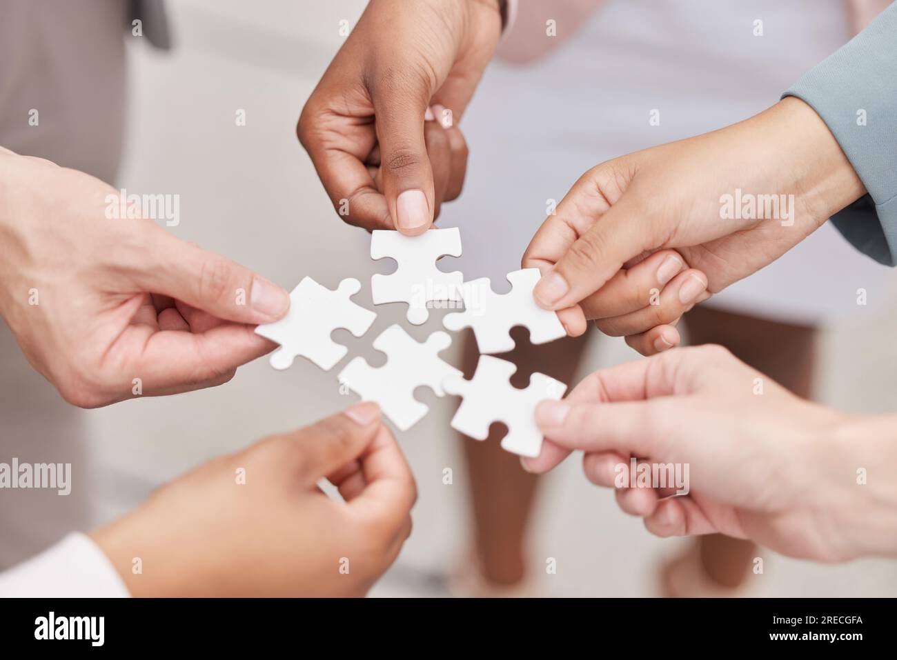 Business people, hands and puzzle for teamwork, mission and problem ...