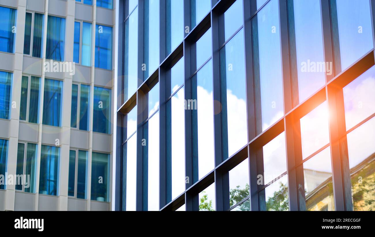 Structural glass wall reflecting blue sky. Abstract modern architecture ...