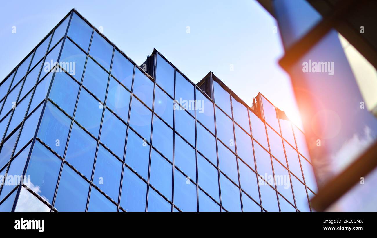Structural glass wall reflecting blue sky. Abstract modern architecture fragment Stock Photo - Alamy