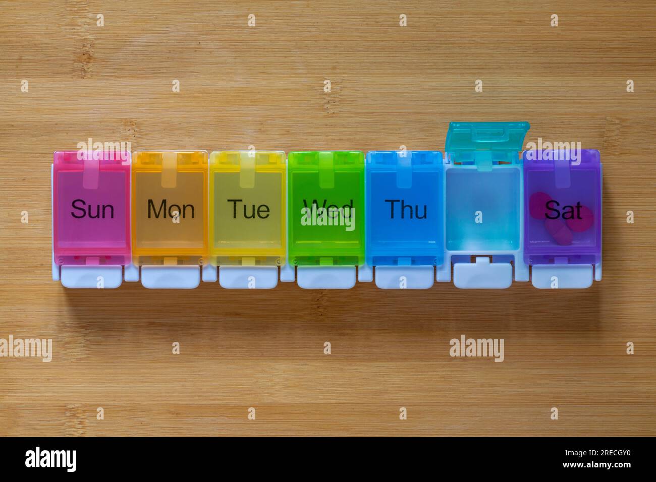 Daily pill box with different colours for different days of week to put ...