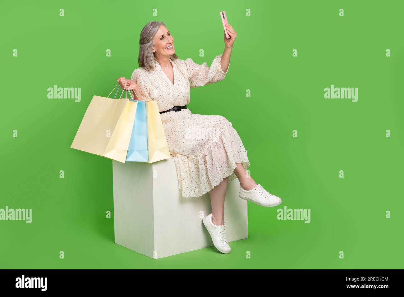 Full length photo of beautiful grandma cube platform shopping bags make ...