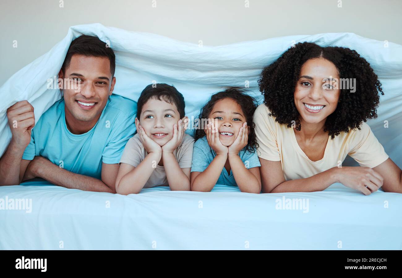 Blanket, bed and portrait of parents with children for bonding, quality ...