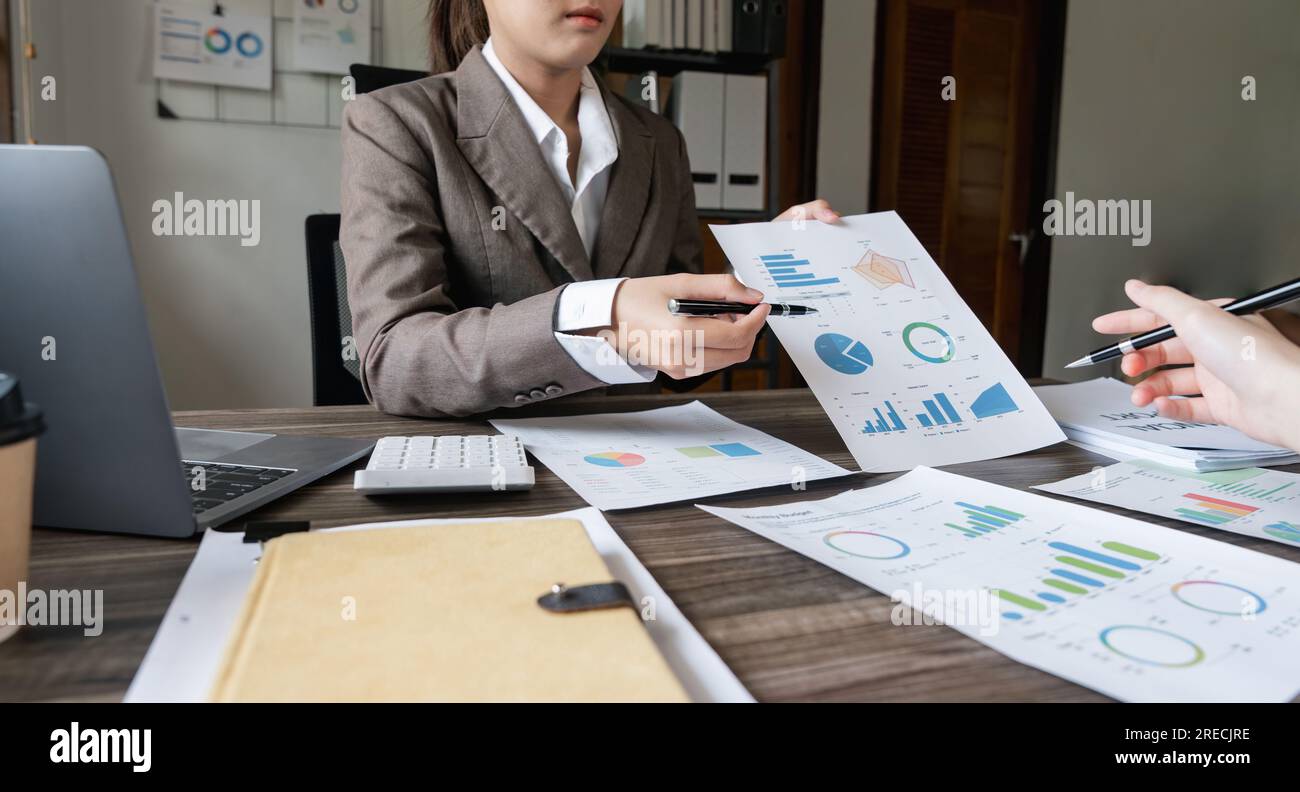 Two businessmen discussion analysis sharing calculations about the ...