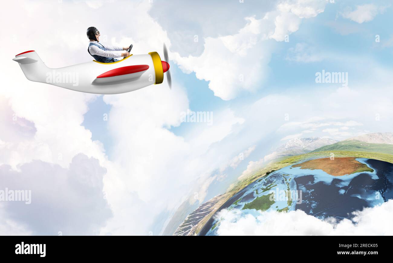 Happy pilot driving small propeller plane Stock Photo - Alamy