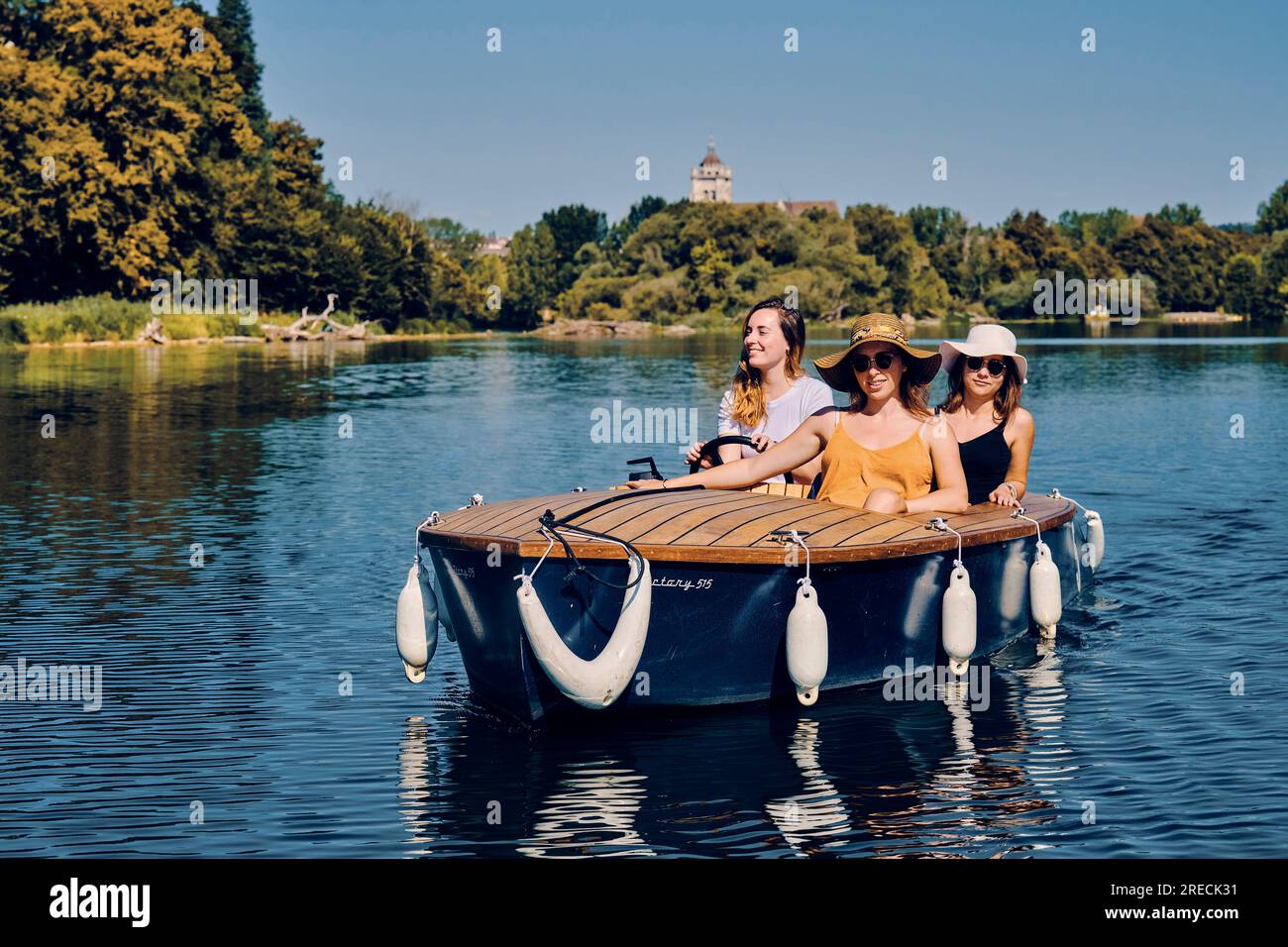 Electric boat, group of friends on a boat trip on the Canal Charles ...