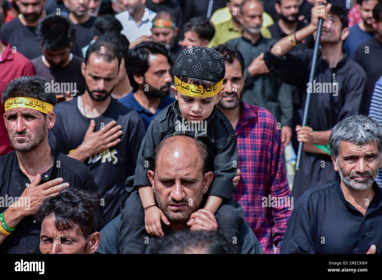 Srinagar, India. 27th July, 2023. Kashmiri Shiite Muslims take part in a religious procession ...