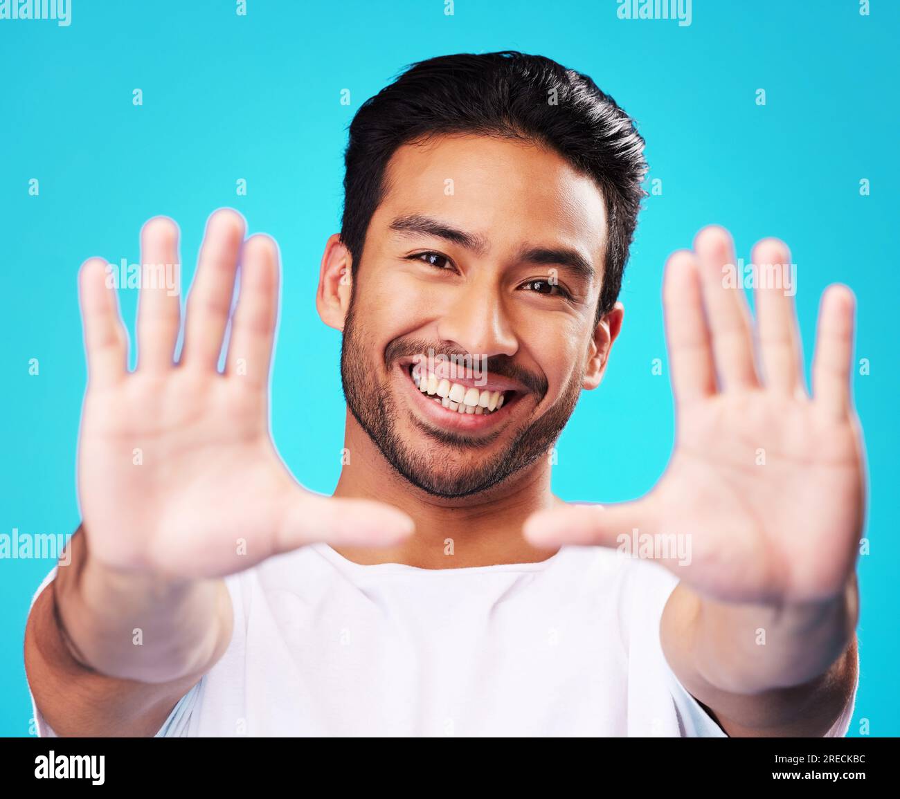 Portrait, hands and man frame face in studio to review profile picture ...