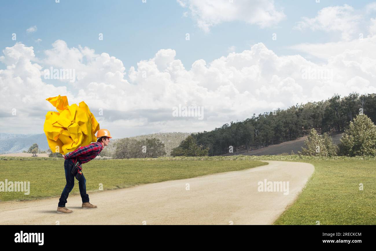 Engineer man carry load Stock Photo - Alamy