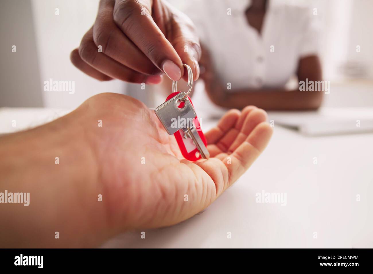 Real Estate House Key Handover By Agent Stock Photo - Alamy