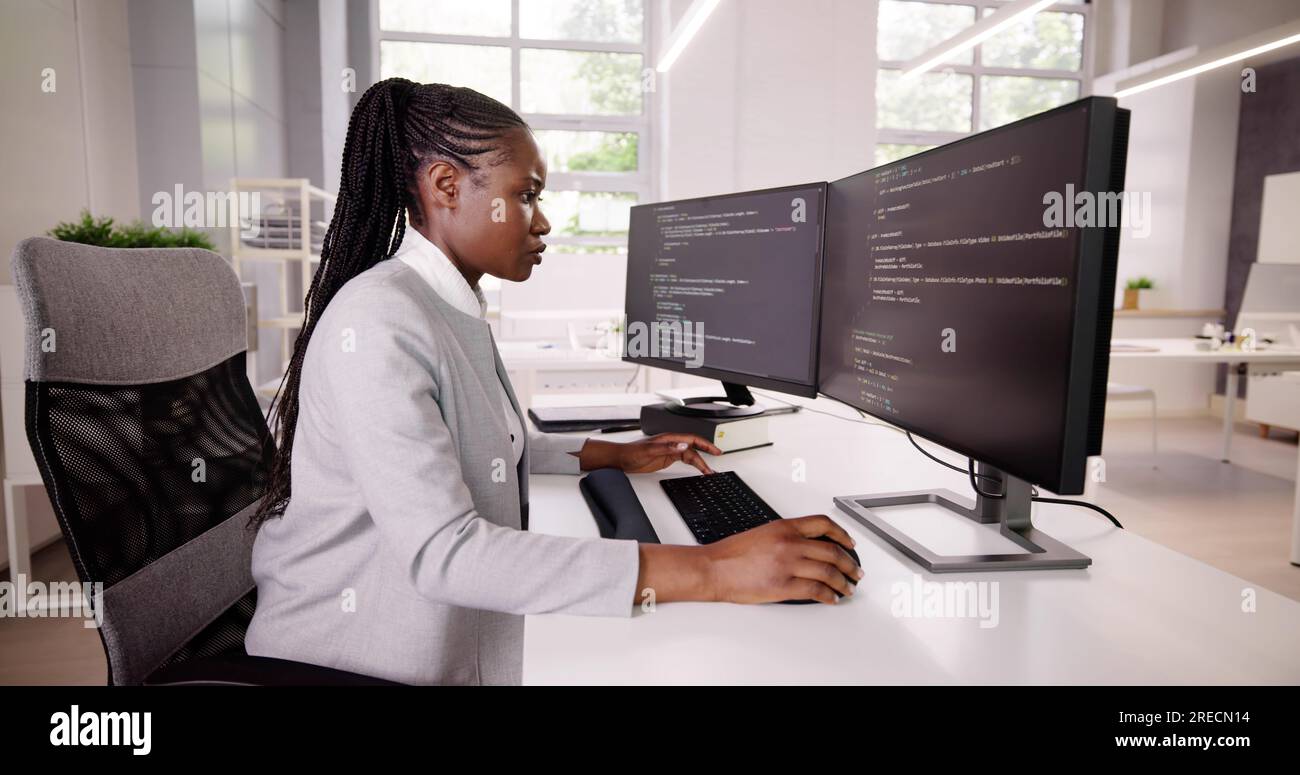 African American Coder Using Computer At Desk. Web Developer Lady Stock Photo - Alamy