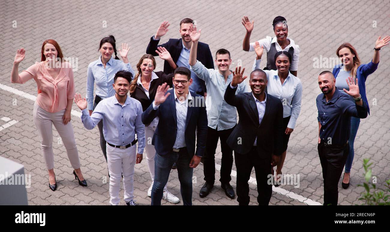 Group Crowd Together With Hands Up Waving Stock Photo - Alamy