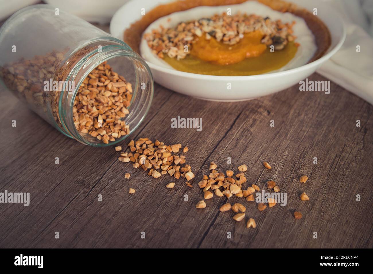 Granulated roasted cashew nuts. Garnish for recipes. Blurred background ...