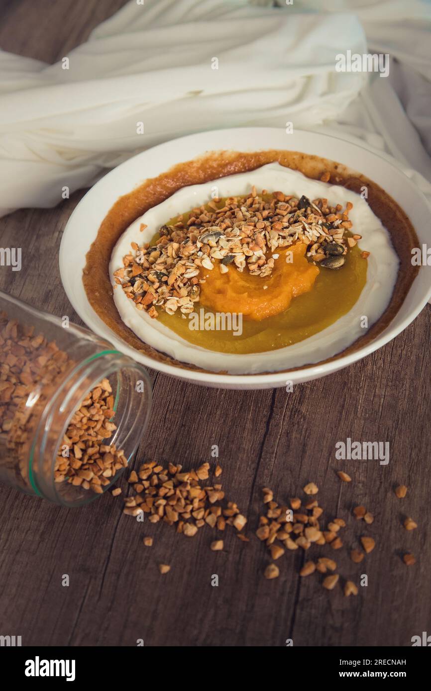 Granulated roasted cashew nuts. Garnish for recipes. Blurred background ...