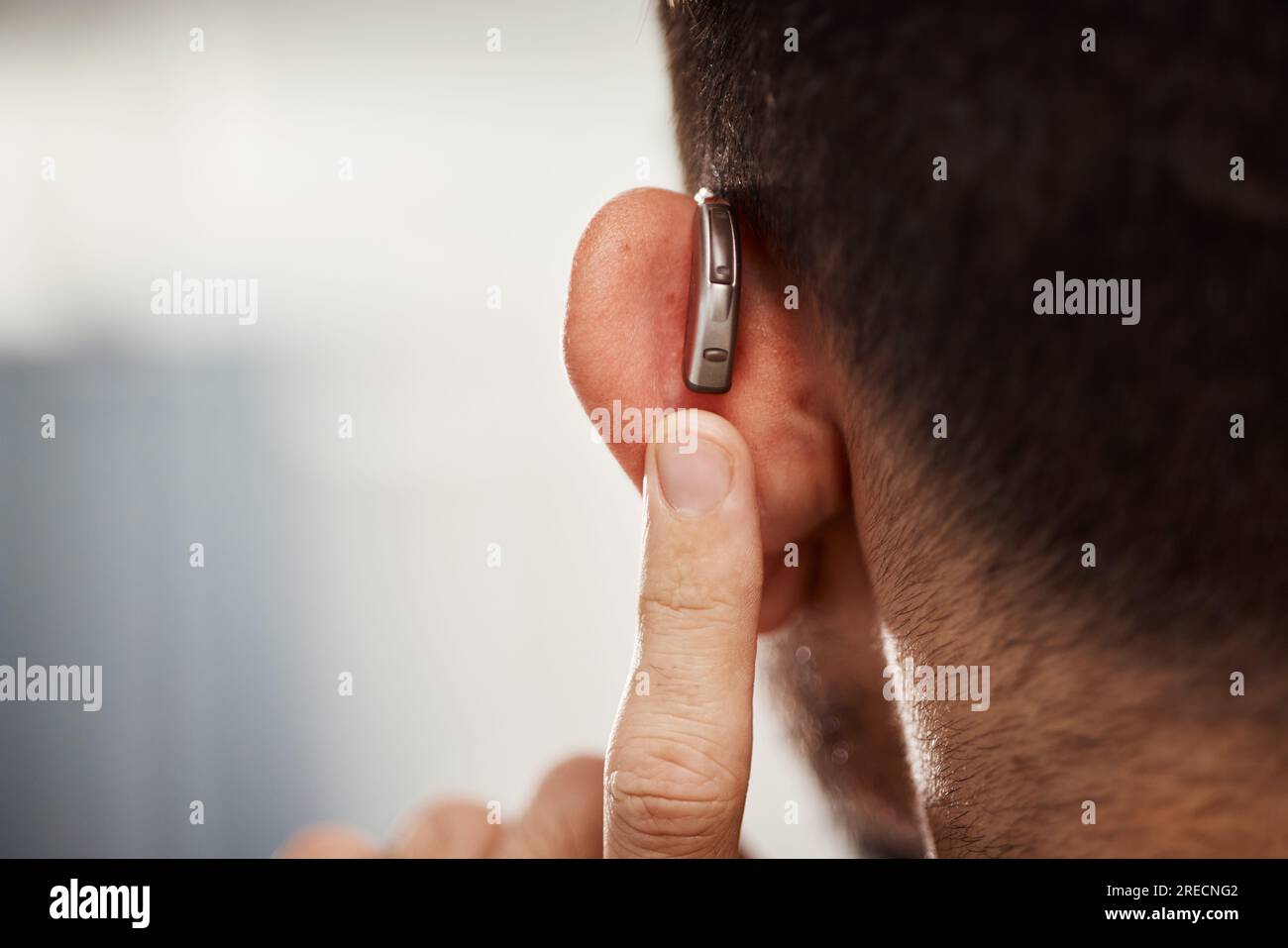 Closeup of ear, hearing aid and man with disability from the back for ...