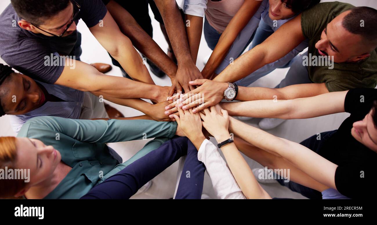 Community Team Spirit And Cohesion. Supporting Hands Stock Photo - Alamy