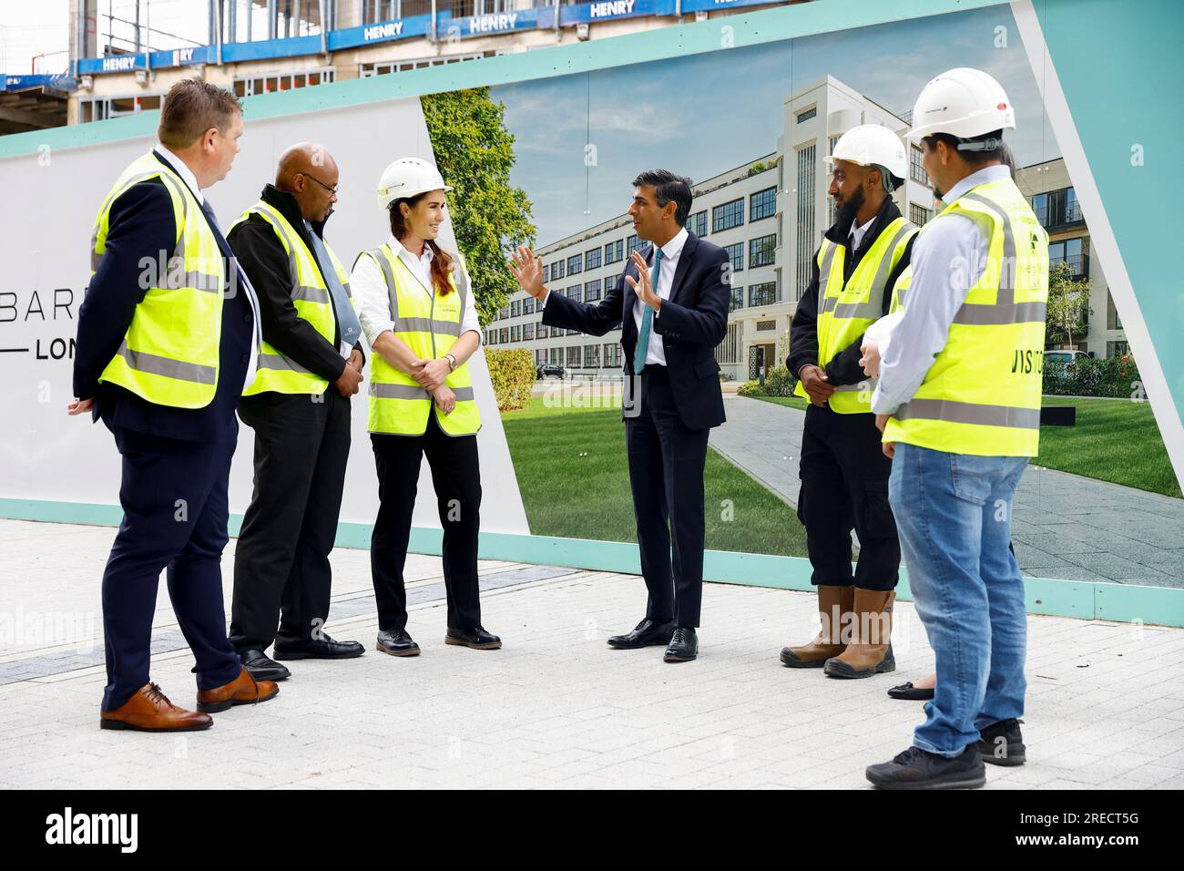 Prime Minister Rishi Sunak speaks to members of staff during a visit to ...