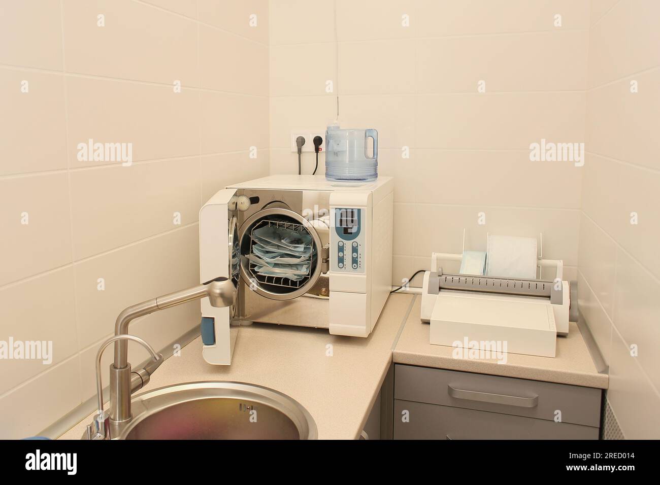Sterilizing medical instruments in autoclave. Dental office. Selective ...