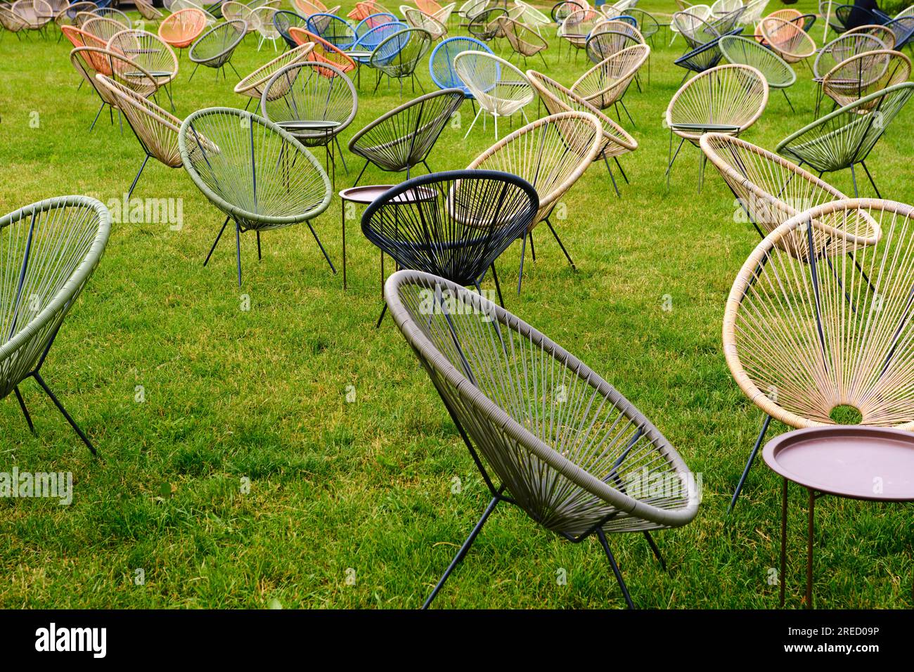 cain chairs in green grass lawn background Stock Photo - Alamy
