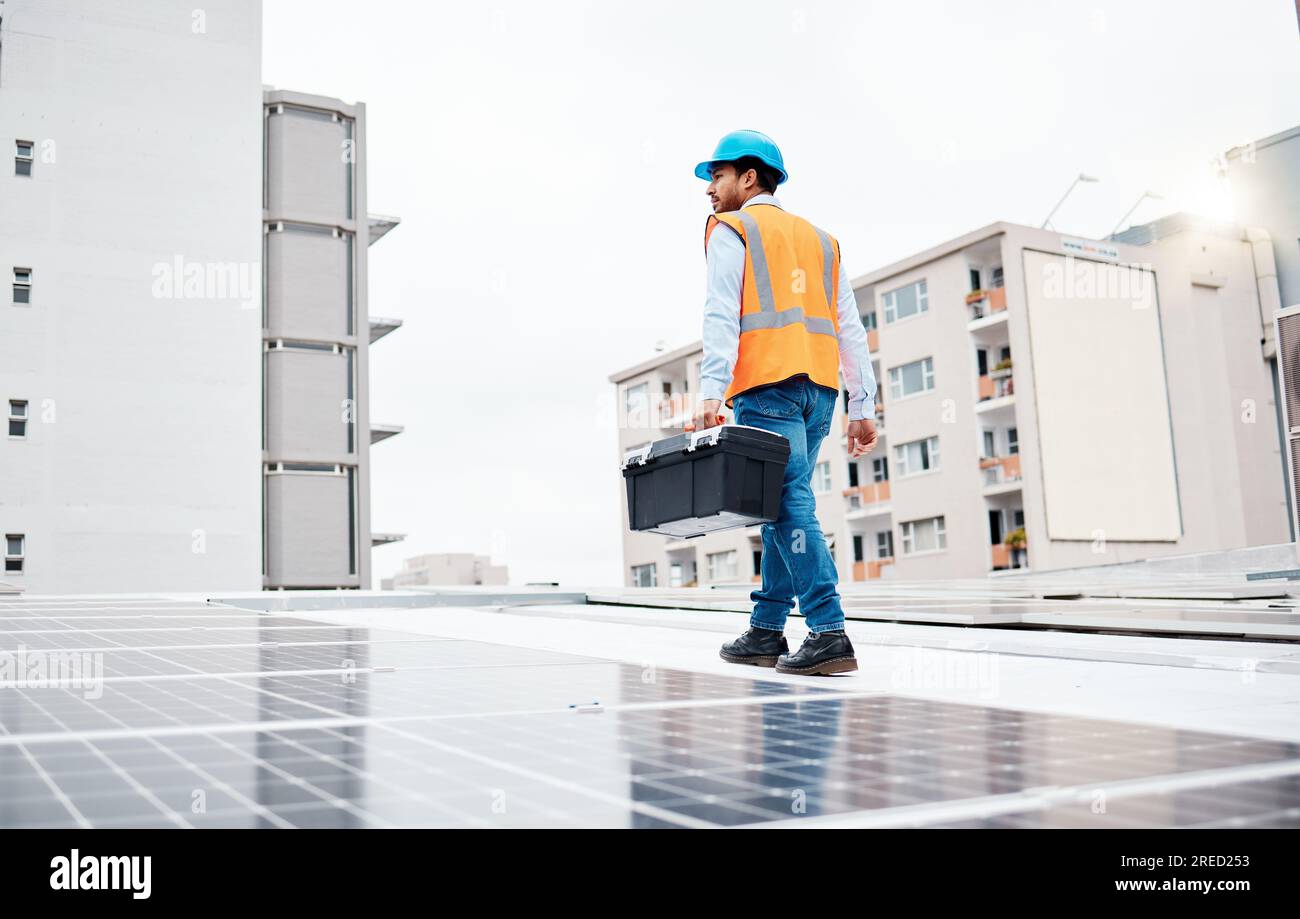 Solar panel, tool box and electricity with man on roof top for ...