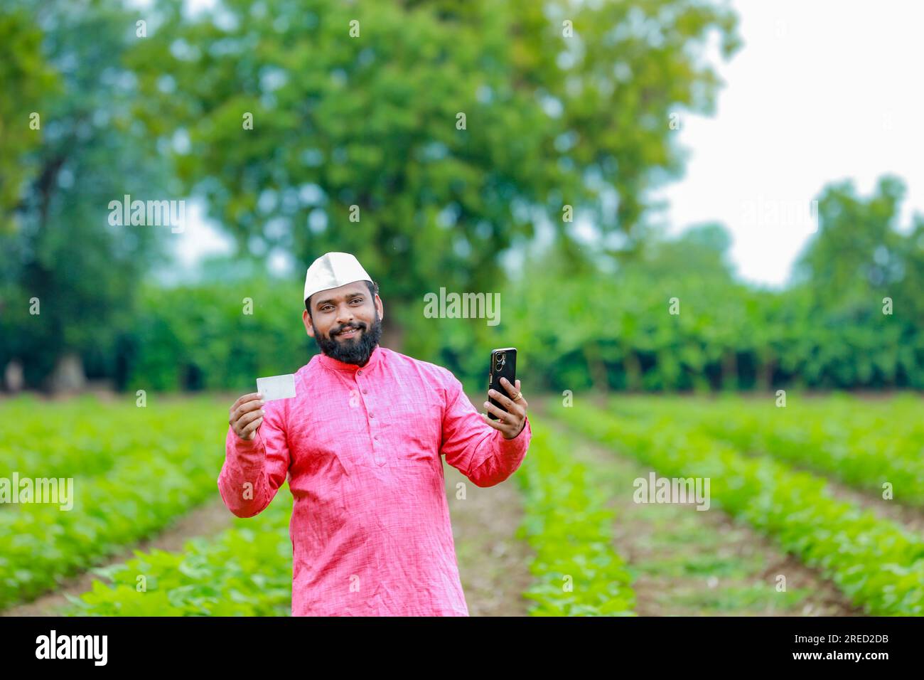 Indian farmer Holding ATM card in hands , happy indian farmer, poor ...