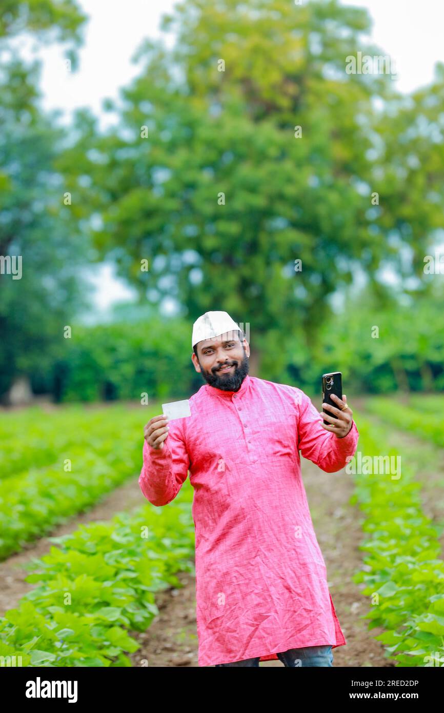 Indian farmer Holding ATM card in hands , happy indian farmer, poor ...