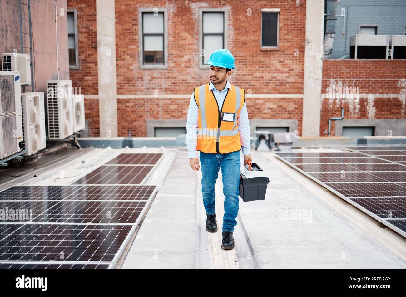 Solar panel, tool box and inspection with man on roof top for renewable ...