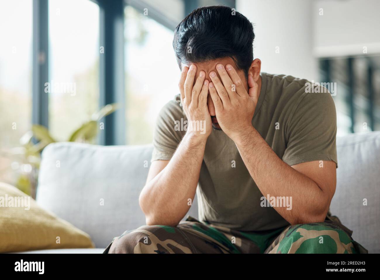 Military, army and a man with trauma and depression while sitting on a ...